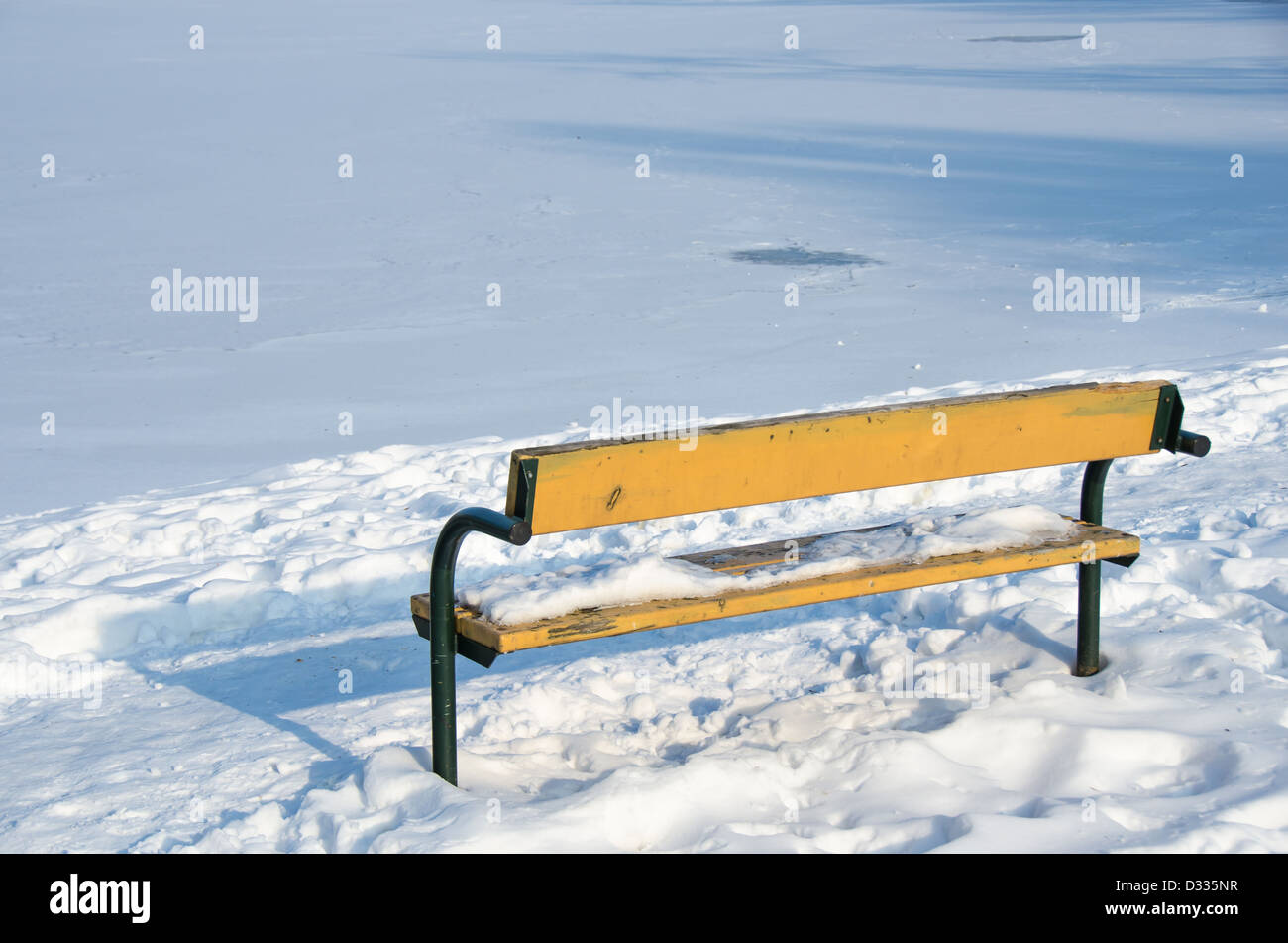Abandoned Outdoor Bench At Frozen And Snowy Lake In Winter Stock Photo ...