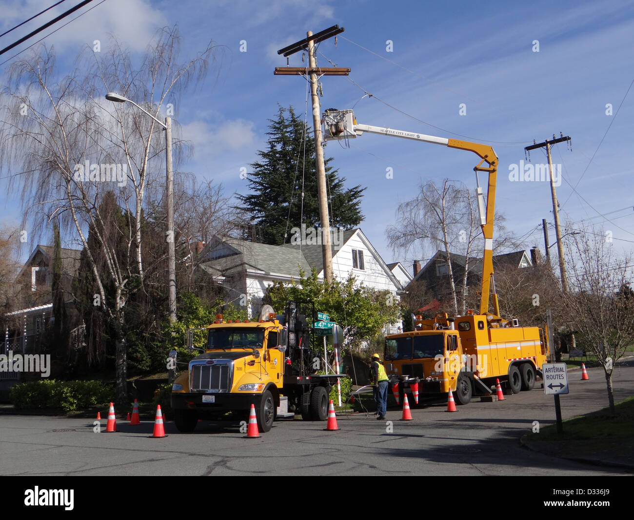 Seattle City Light workmen replace an aging utility pole as part of a ...