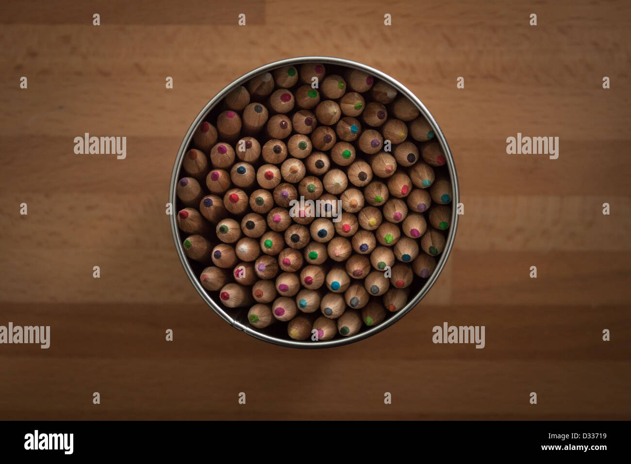 Top view of a box with crayons on wooden surface Stock Photo - Alamy