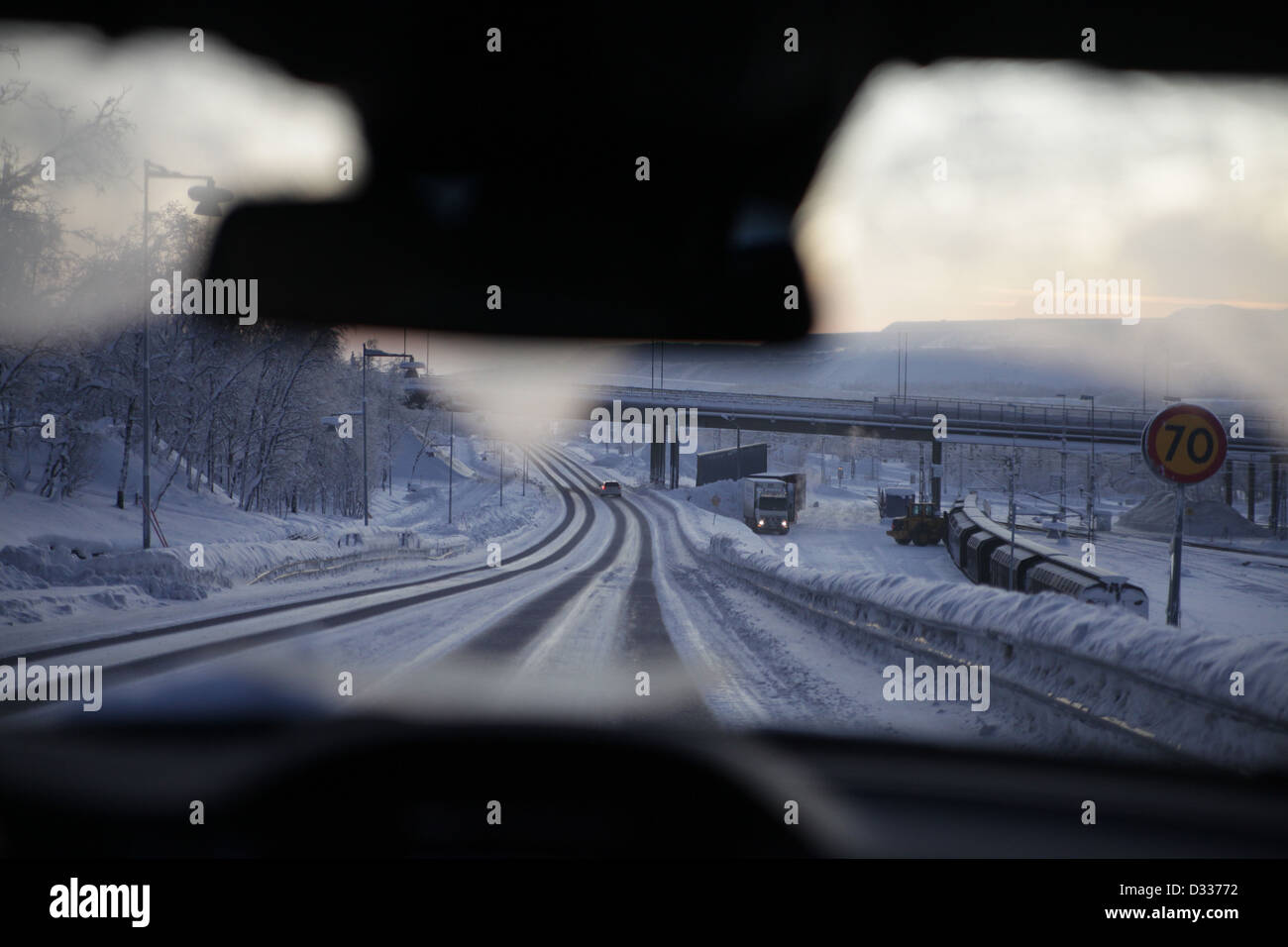 Road covered in snow and ice taken from inside car Stock Photo - Alamy