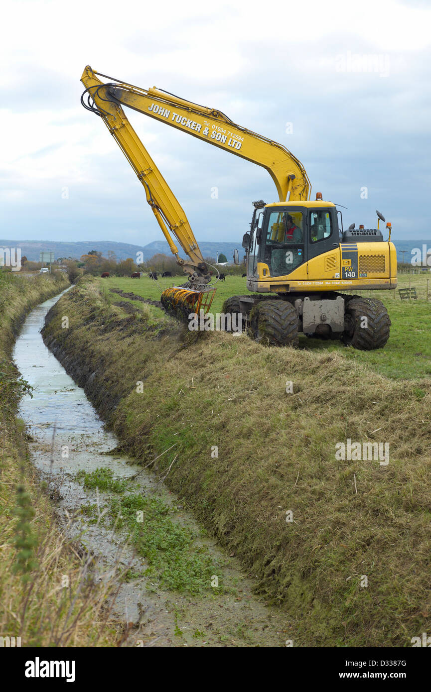 vehicle removing weed from ditch North Somerset England Stock Photo - Alamy