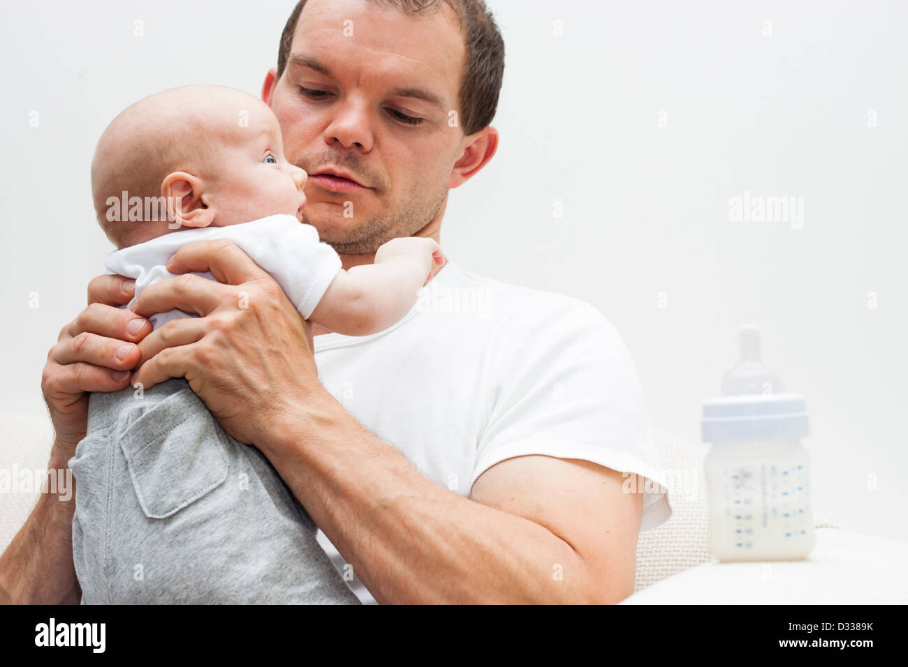 Man with a baby bottle of milk hi-res stock photography and images - Alamy