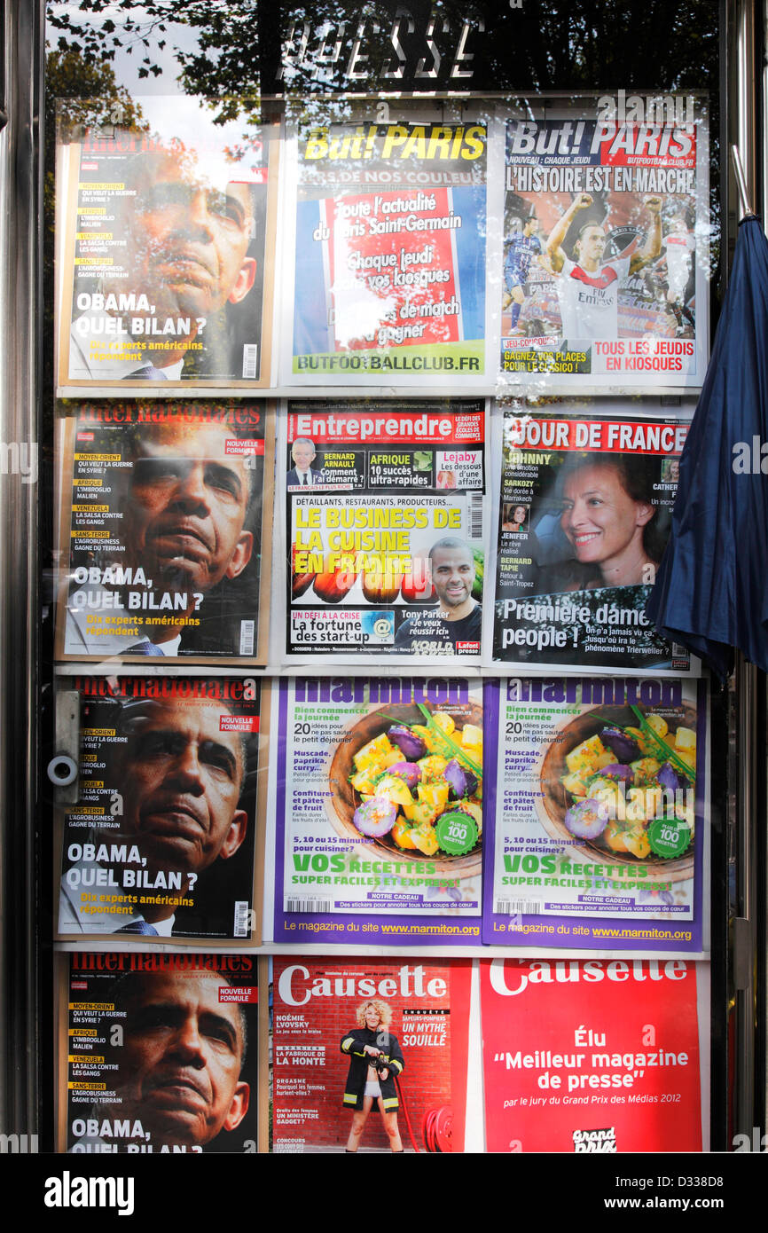 Magazines in the shop window of a newspaper stand in Paris Stock Photo ...
