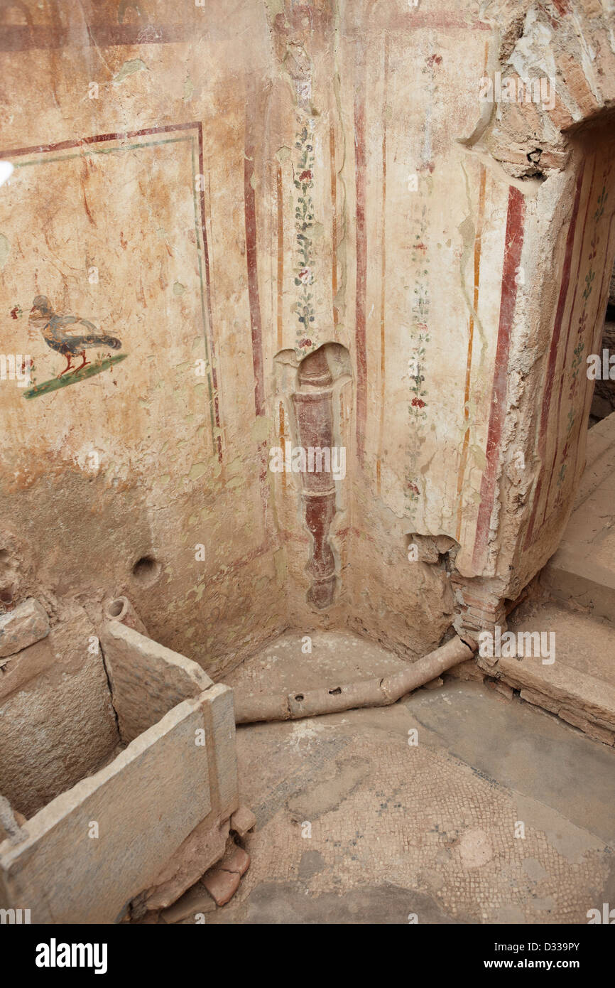 Clay heating pipes in the wall and on the floor in an ancient Roman ...