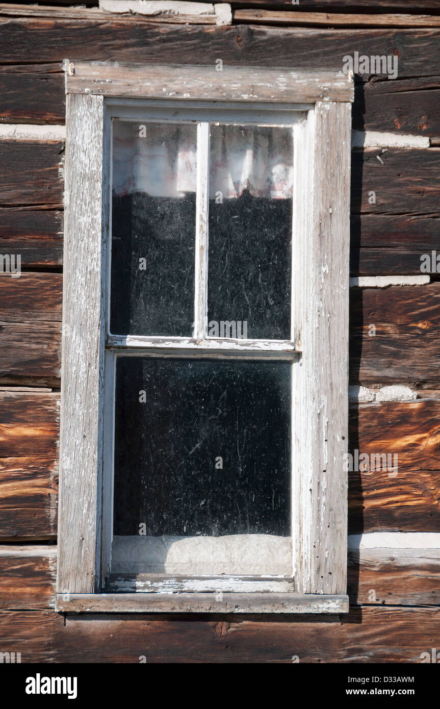 Window and wall of an old log ranch house in Northeast Oregon Stock ...