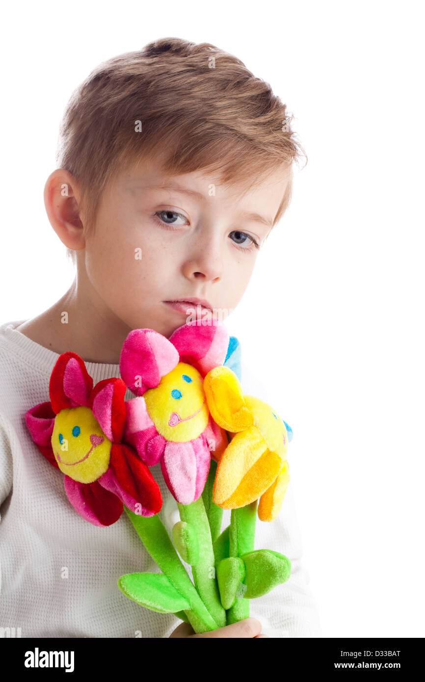 depressed and sad looking young boy holding a bunch of brightly colored ...