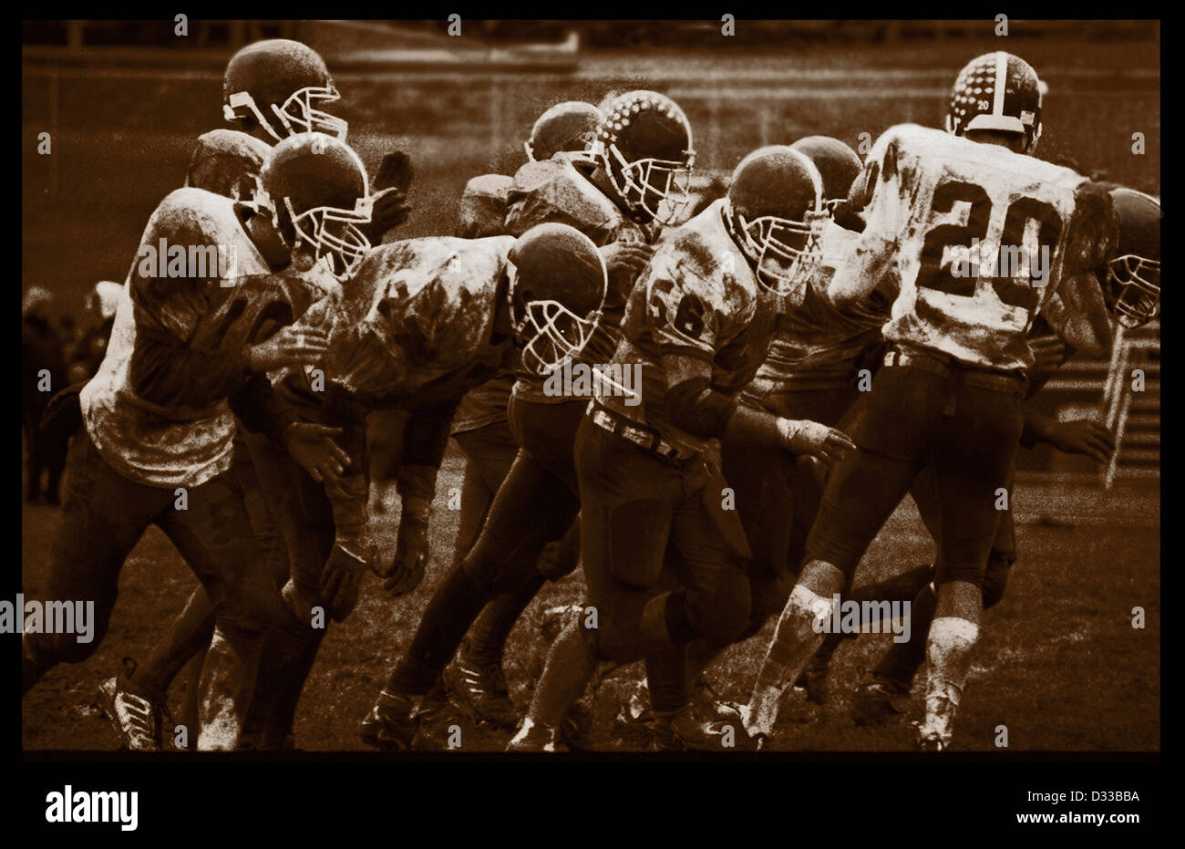 muddy football team ready for next play Stock Photo - Alamy