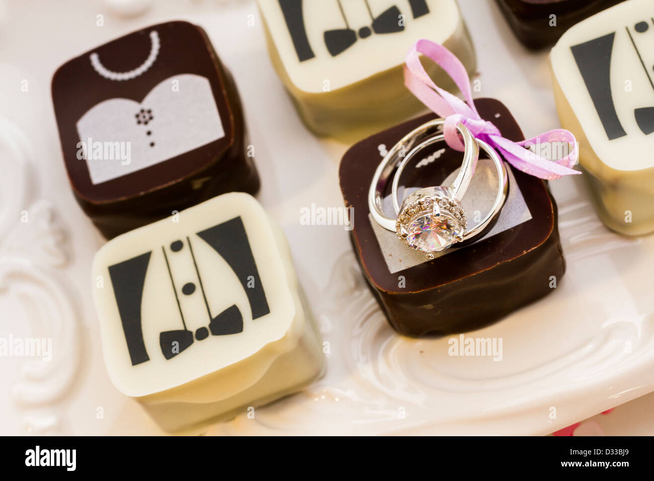 Small chocolates decorated for the wedding party Stock Photo - Alamy