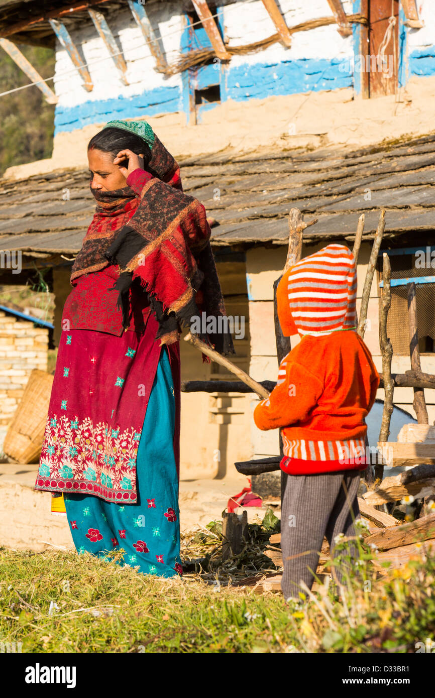 A Nepalese woman and child in traditional clothing in the Himalayan ...