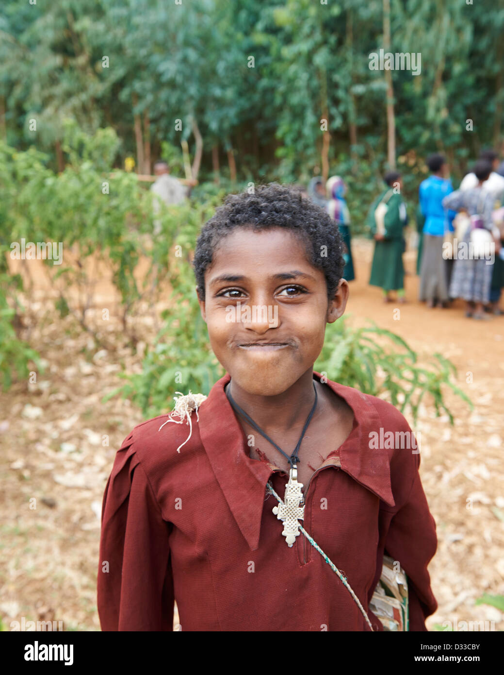 A young boy wearing a coptic cross around his neck poses Stock Photo ...
