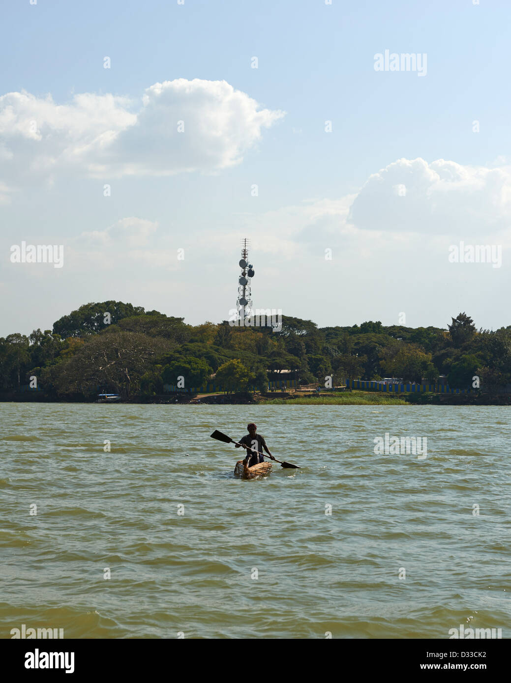 A priest on a traditional papyrus kayak paddles to one of the many ...