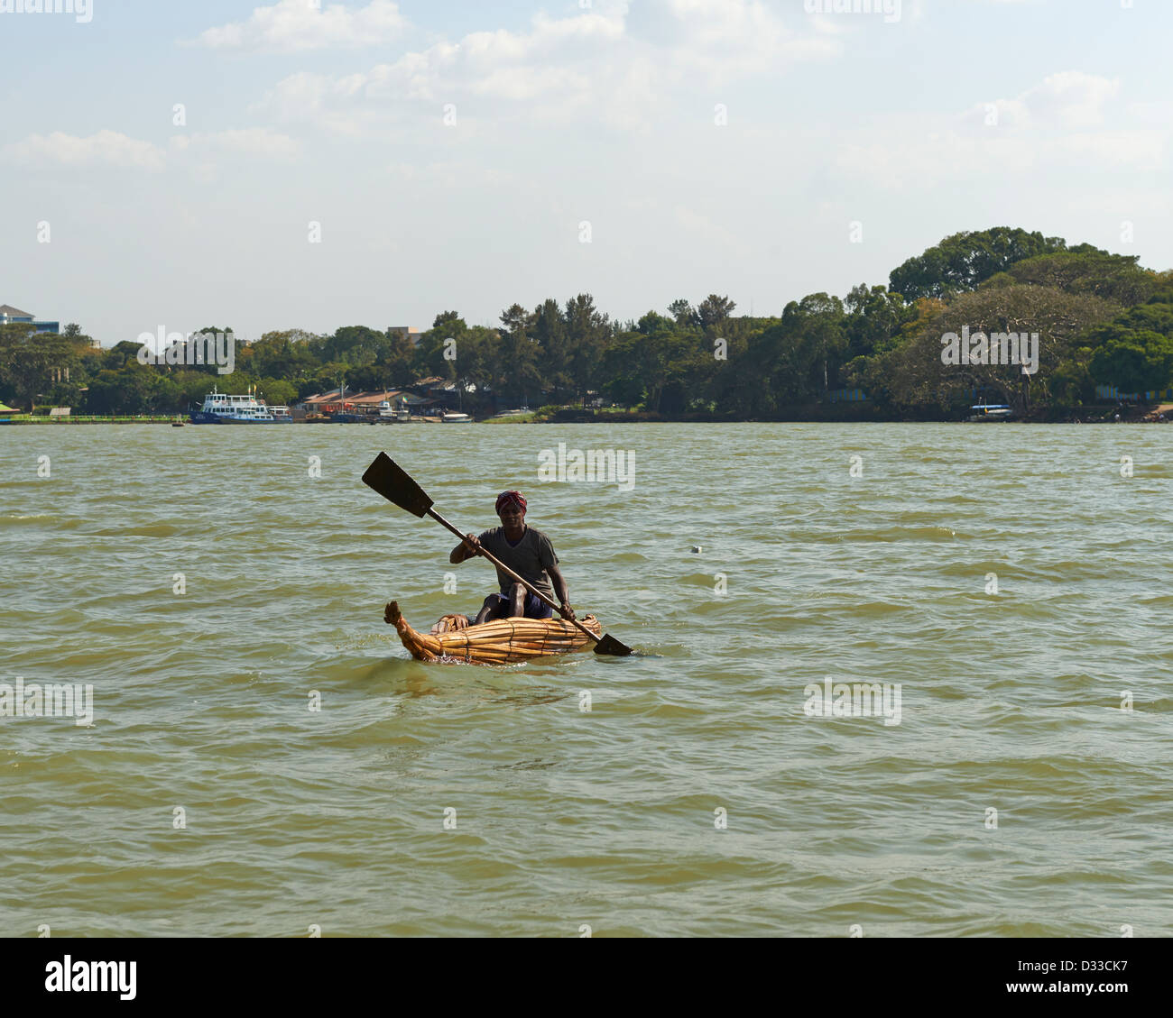 A priest on a traditional papyrus kayak paddles to one of the many ...