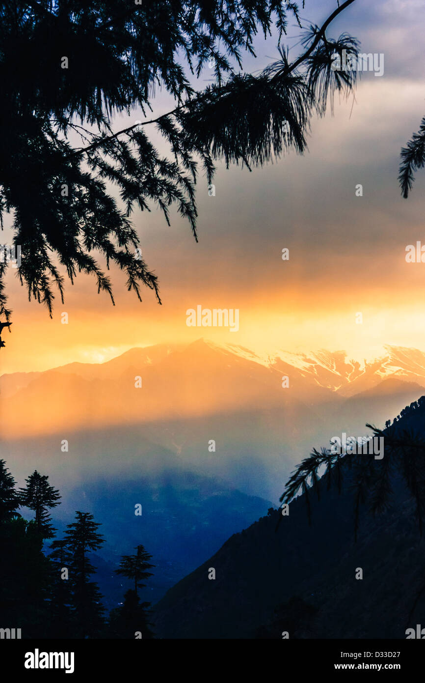 Crepuscular light shaft over Himalaya mountains. Naggar, Himachal ...