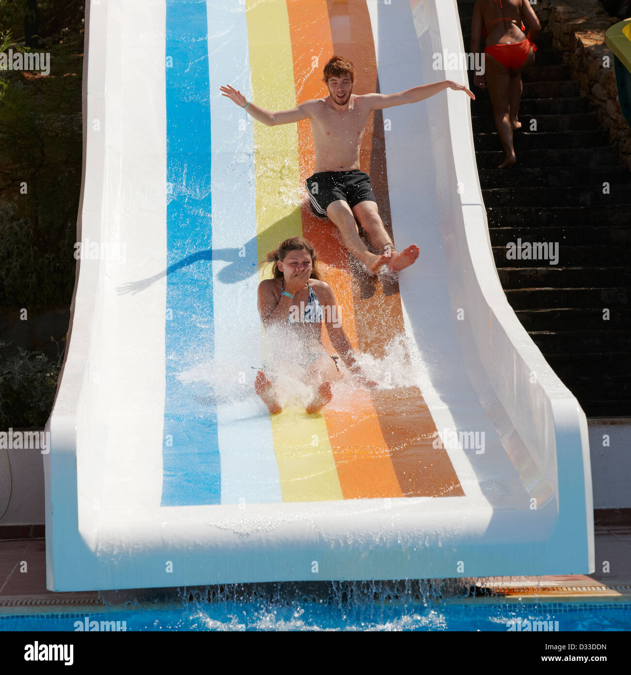 Tourists enjoy waterslides at Caliente Bodrum Resort Hotel. Torba ...