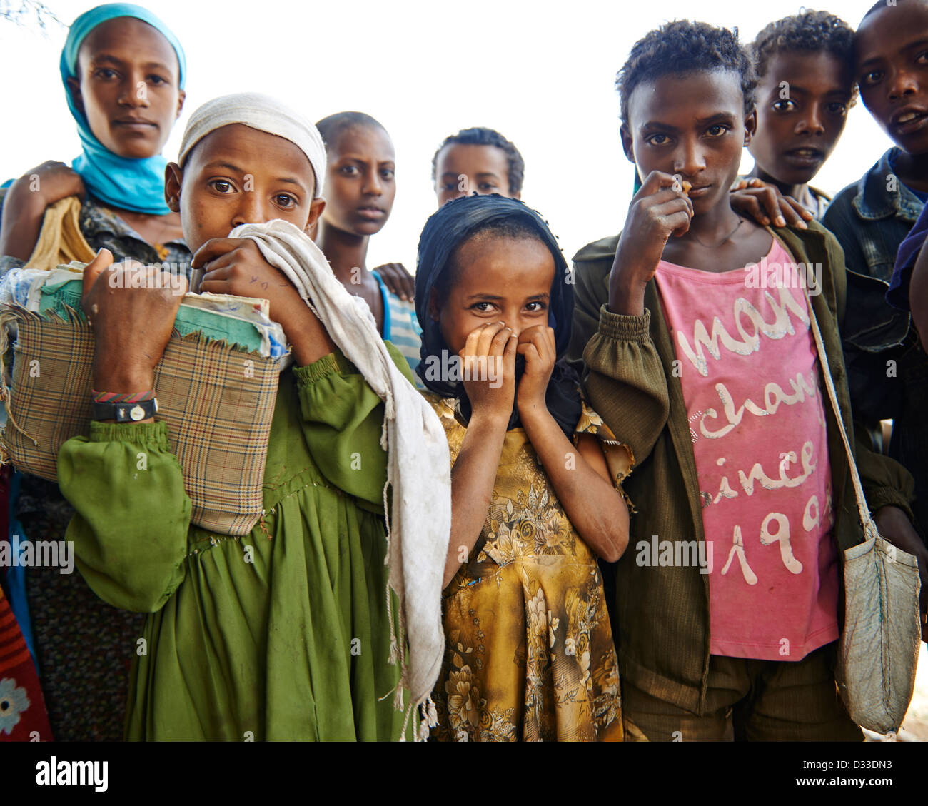 A group of local children making faces and posing for the camera Stock ...