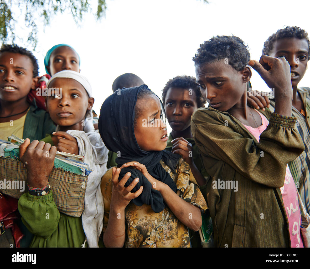 A group of local children making faces and posing for the camera Stock ...