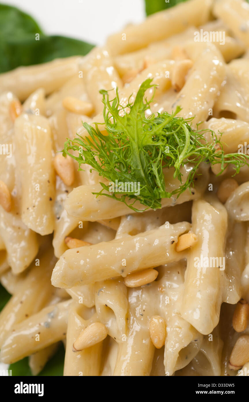 Italian traditional pasta penne gorgonzola and pine nuts Stock Photo ...