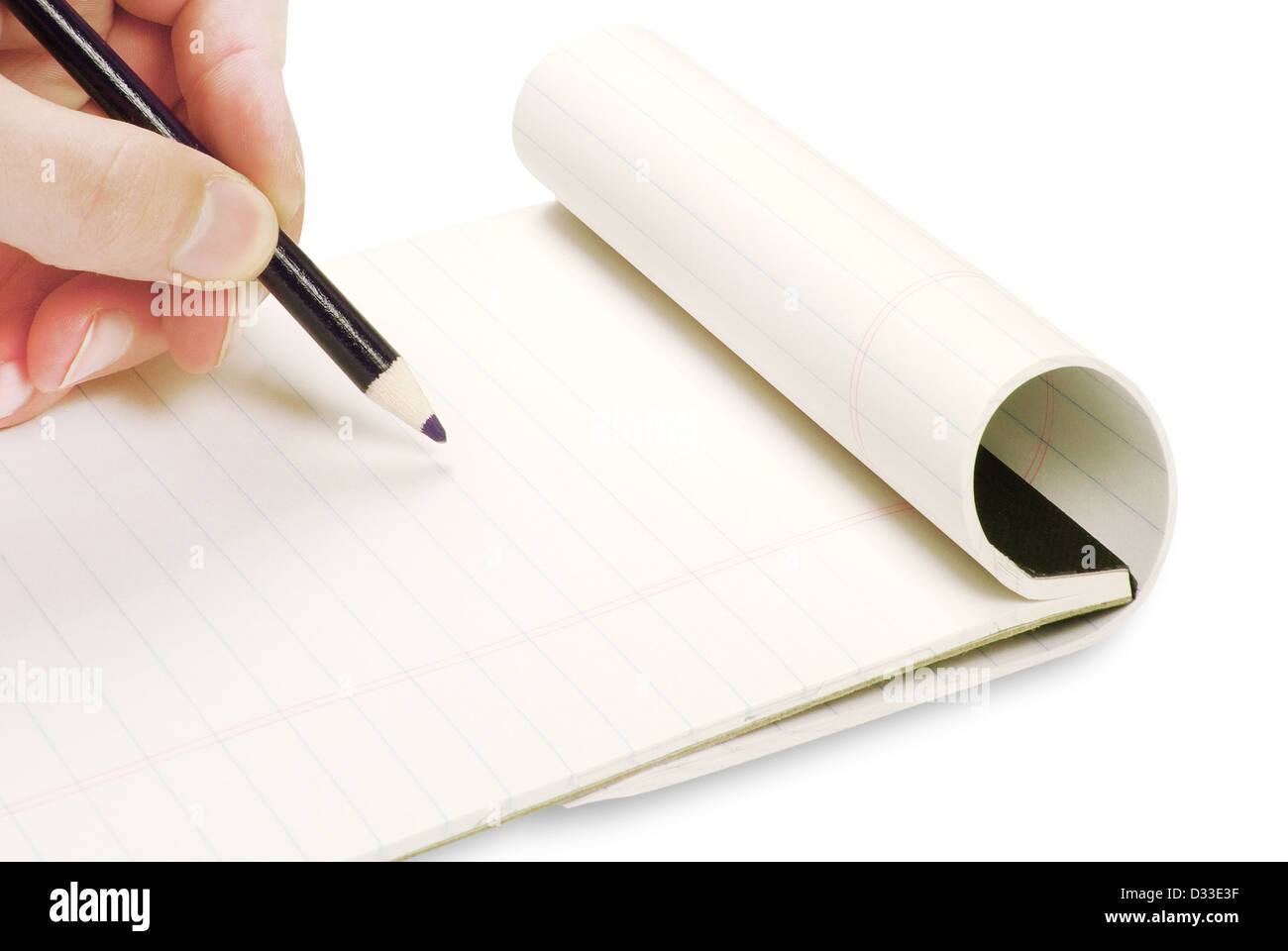 Pencil in hand writing on the notebook Stock Photo - Alamy
