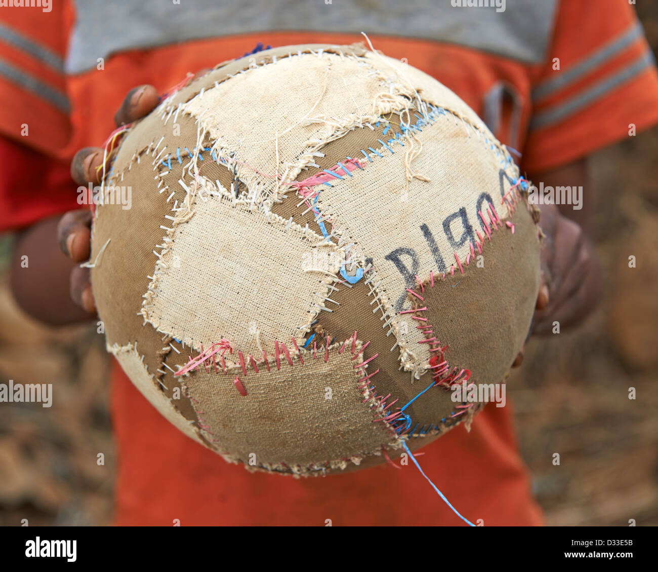 A child holding a homemade football or soccer ball Stock Photo - Alamy