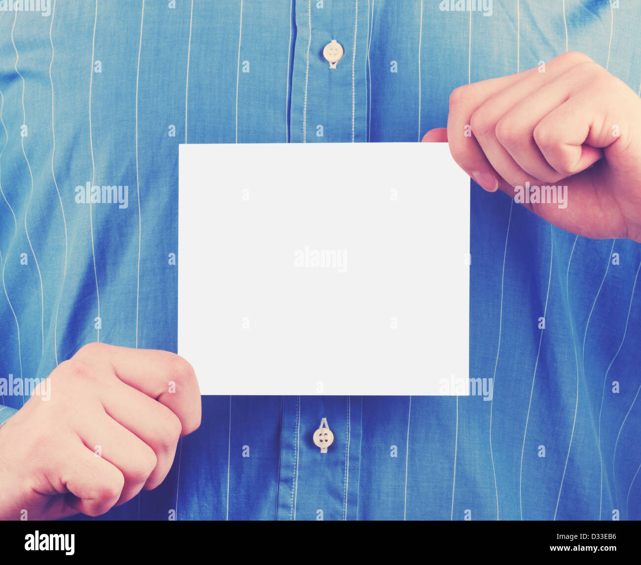 Closeup of businessman's hand holding up card Stock Photo - Alamy