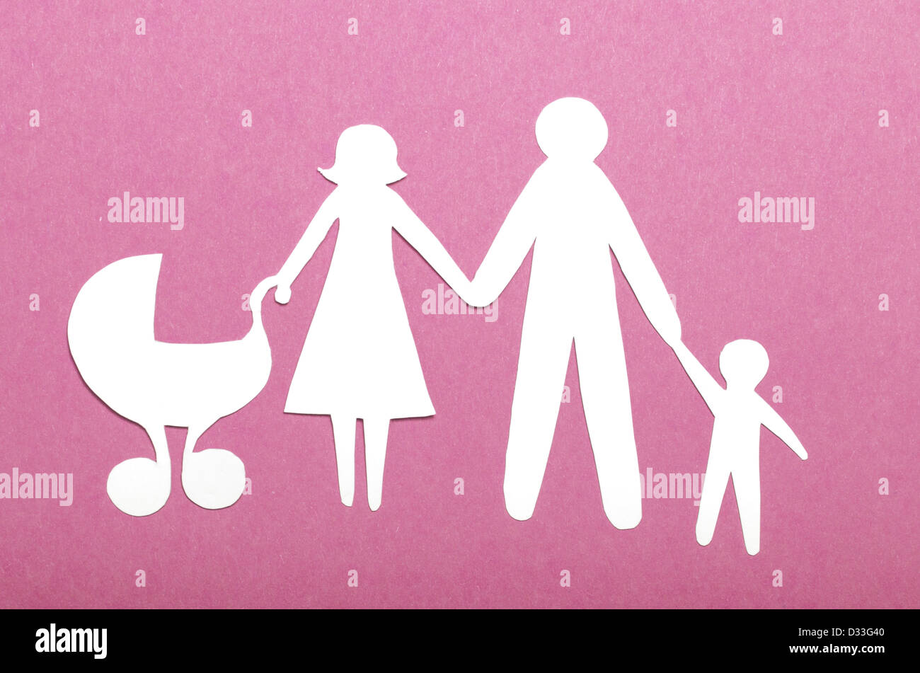 Closeup of paper family on green background Stock Photo - Alamy