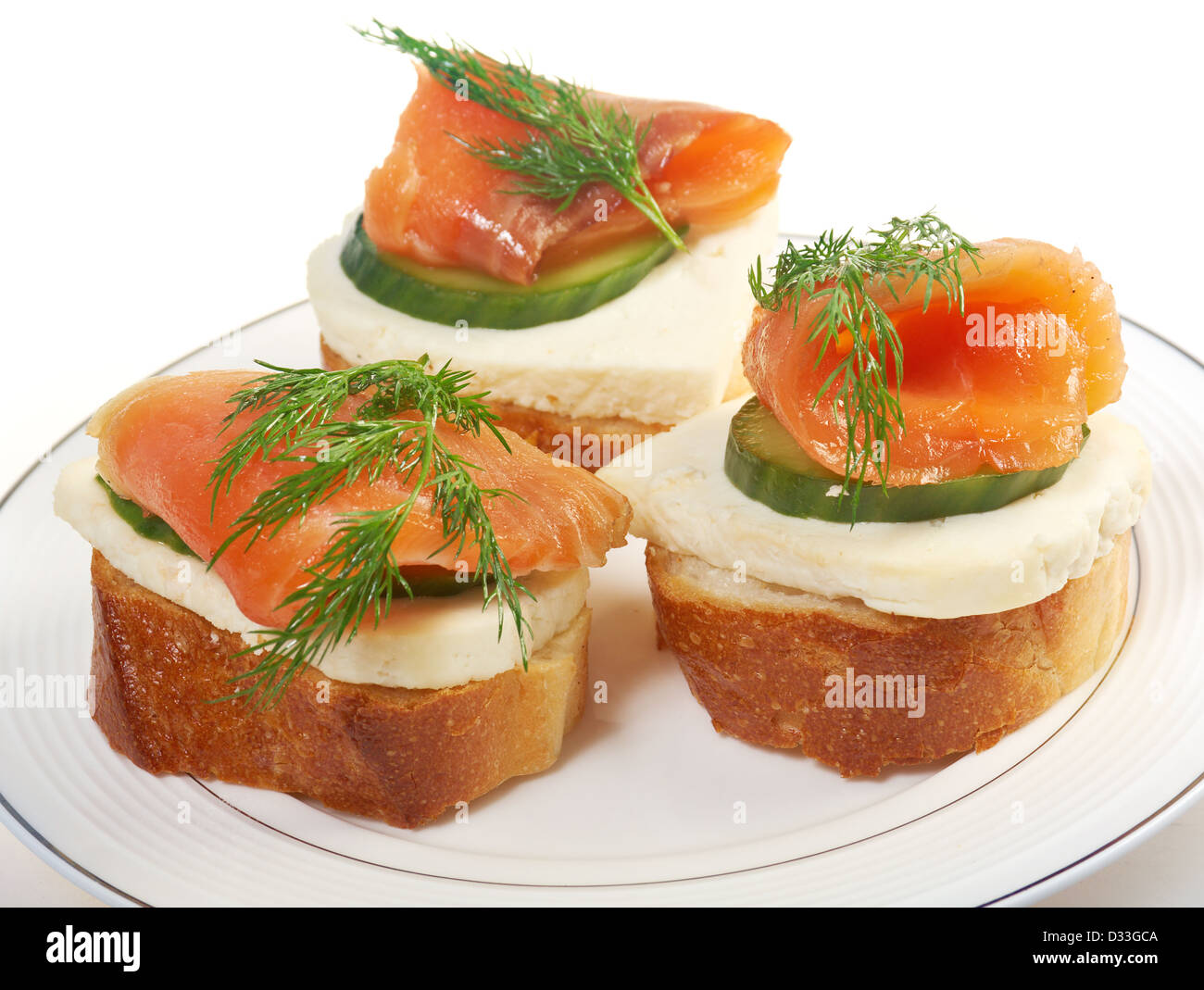 Canapes with smoked salmon,cheese and cucumber. close up Stock Photo ...