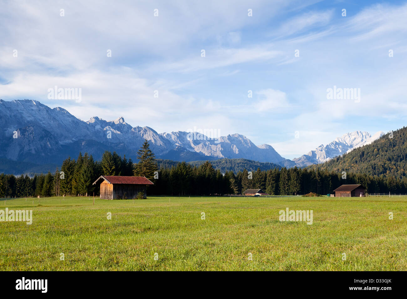 wooden hut on alpine meadows in morning sunlight Stock Photo - Alamy