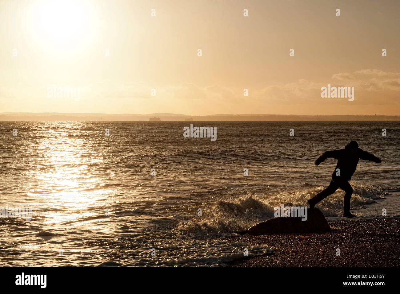 Man running on beach waves hi-res stock photography and images - Alamy