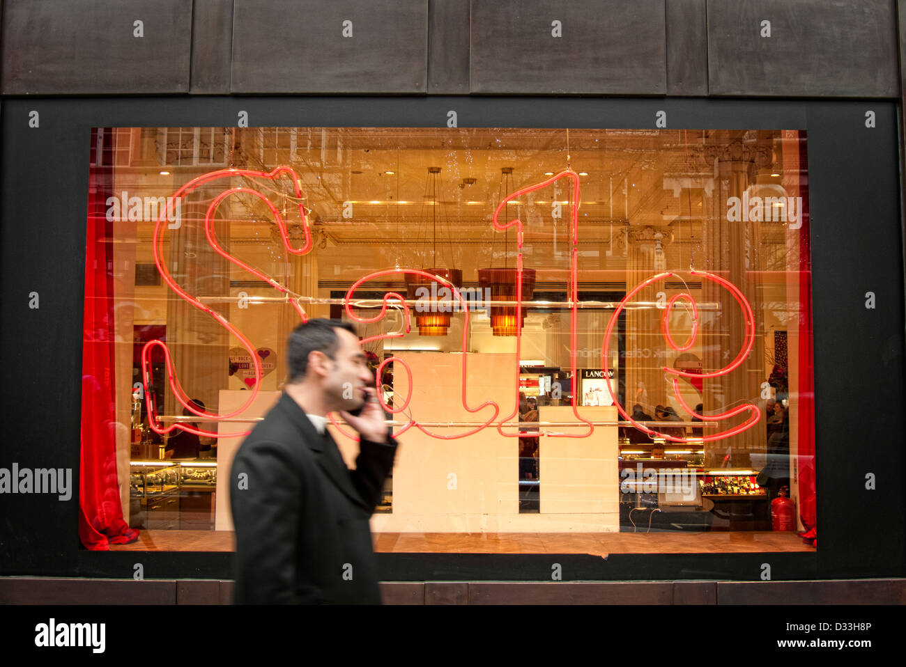 neon sale sign in department store window Stock Photo - Alamy