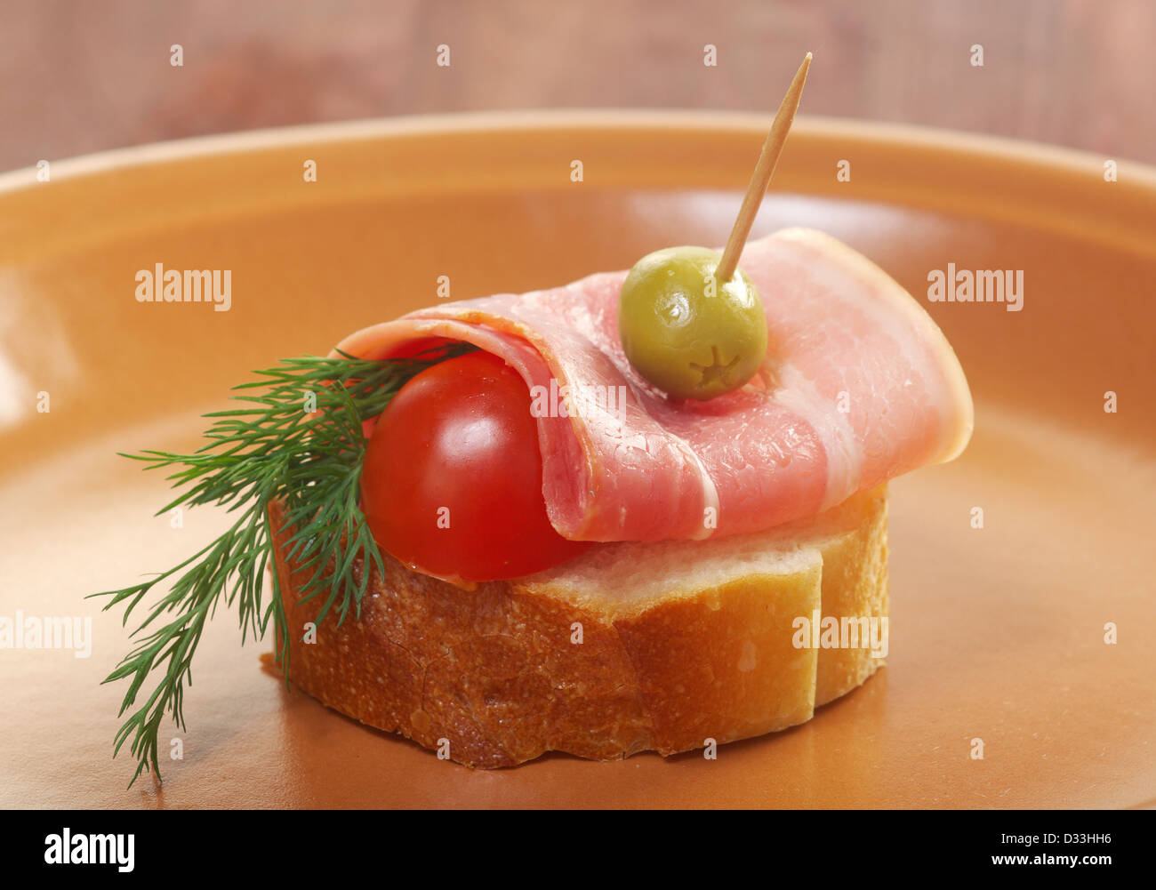 Canapes with smoked bacon Stock Photo - Alamy