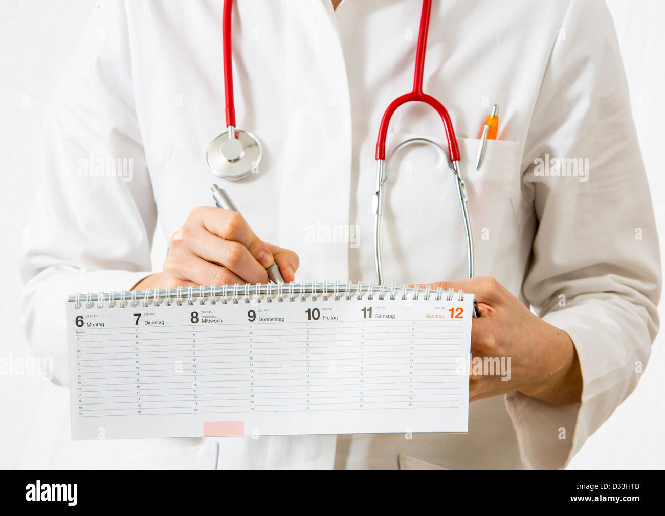 Symbolic image medicine. Doctor is writing down appointments in a ...