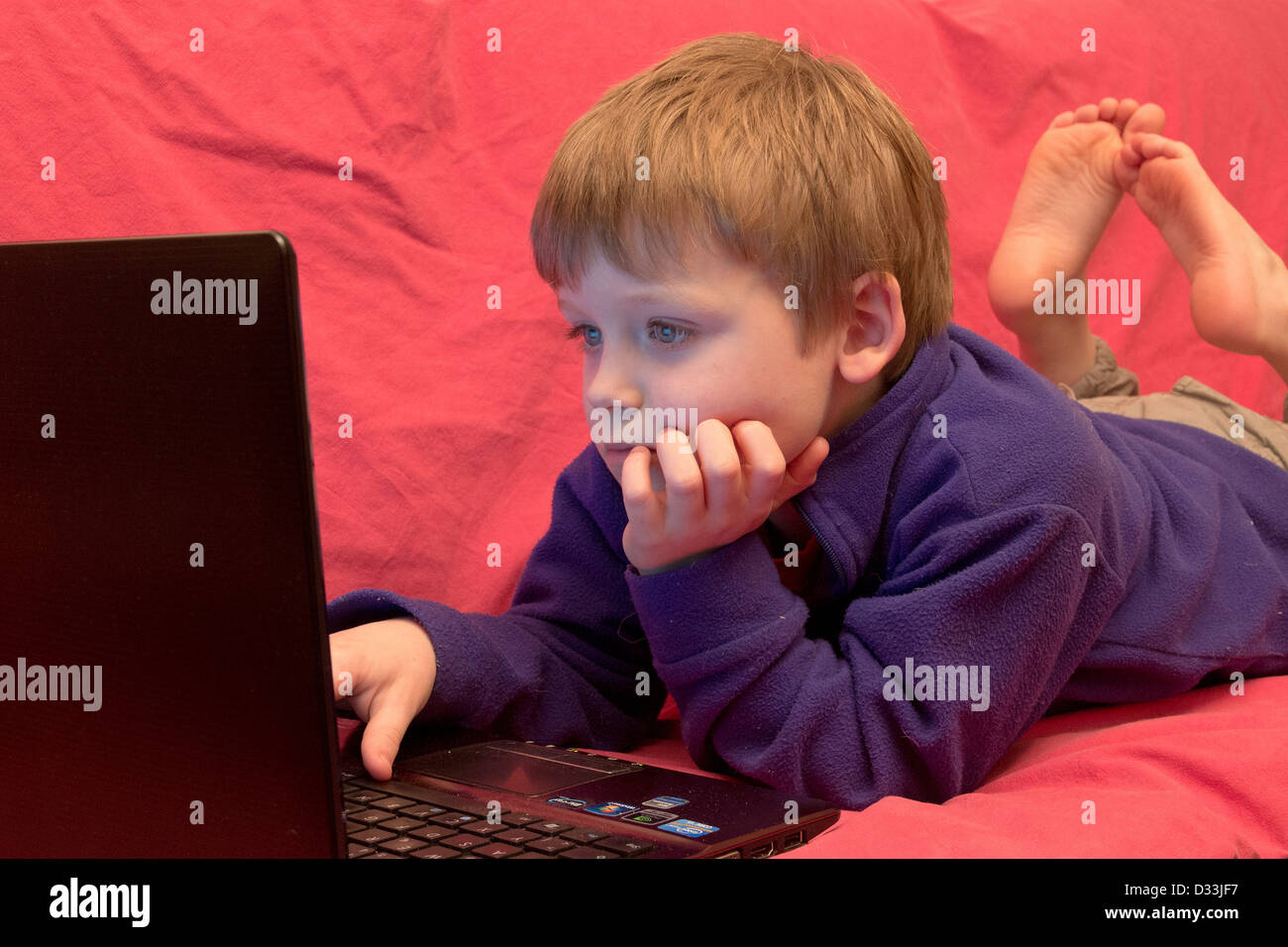 portrait of a young boy with a laptop Stock Photo - Alamy