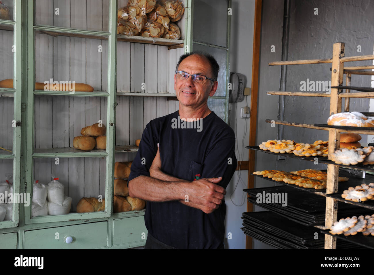 Baker Juan Olives Morro, of Sant Climent, Menorca, with freshly baked ...