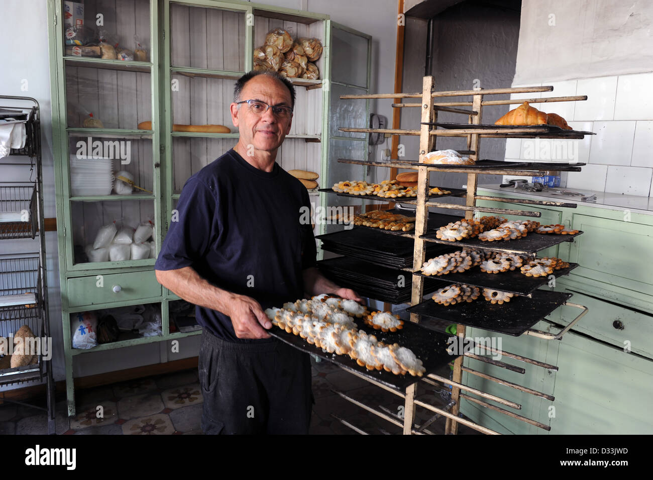 Baker Juan Olives Morro, of Sant Climent, Menorca, with freshly baked ...