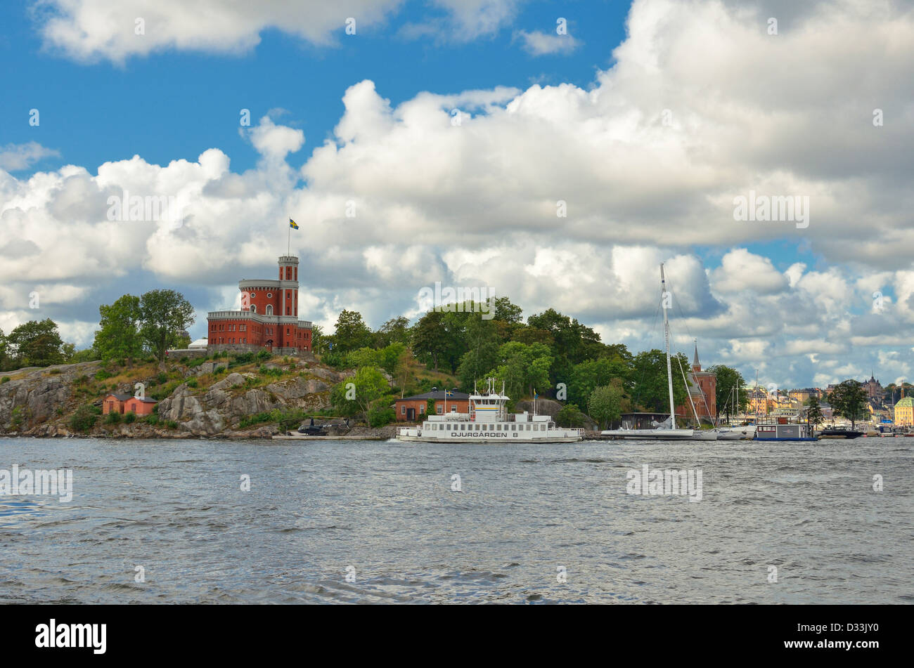 Tour boat ferry passes medieval style castle on Kastelholmen, Stockholm ...