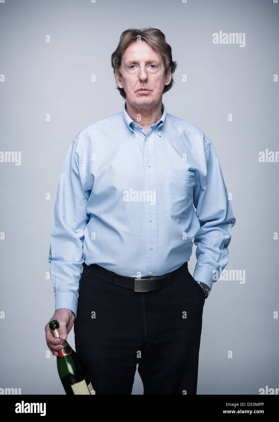 Successful middle aged professional man with champagne bottle Stock ...