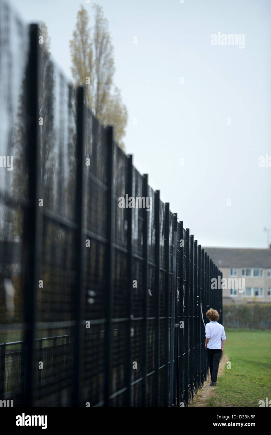 A school child walking alone at a secondary school UK Stock Photo - Alamy