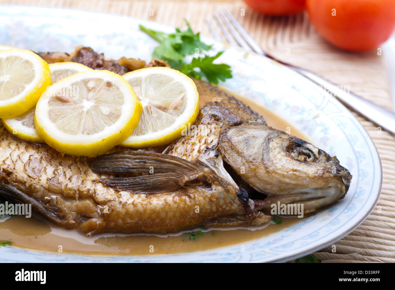 Cooked fish ready for eating - China food style Stock Photo - Alamy