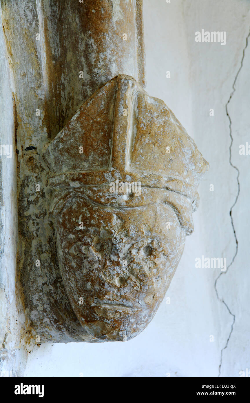 A view of a carved Bishops head by the north door of the parish church ...