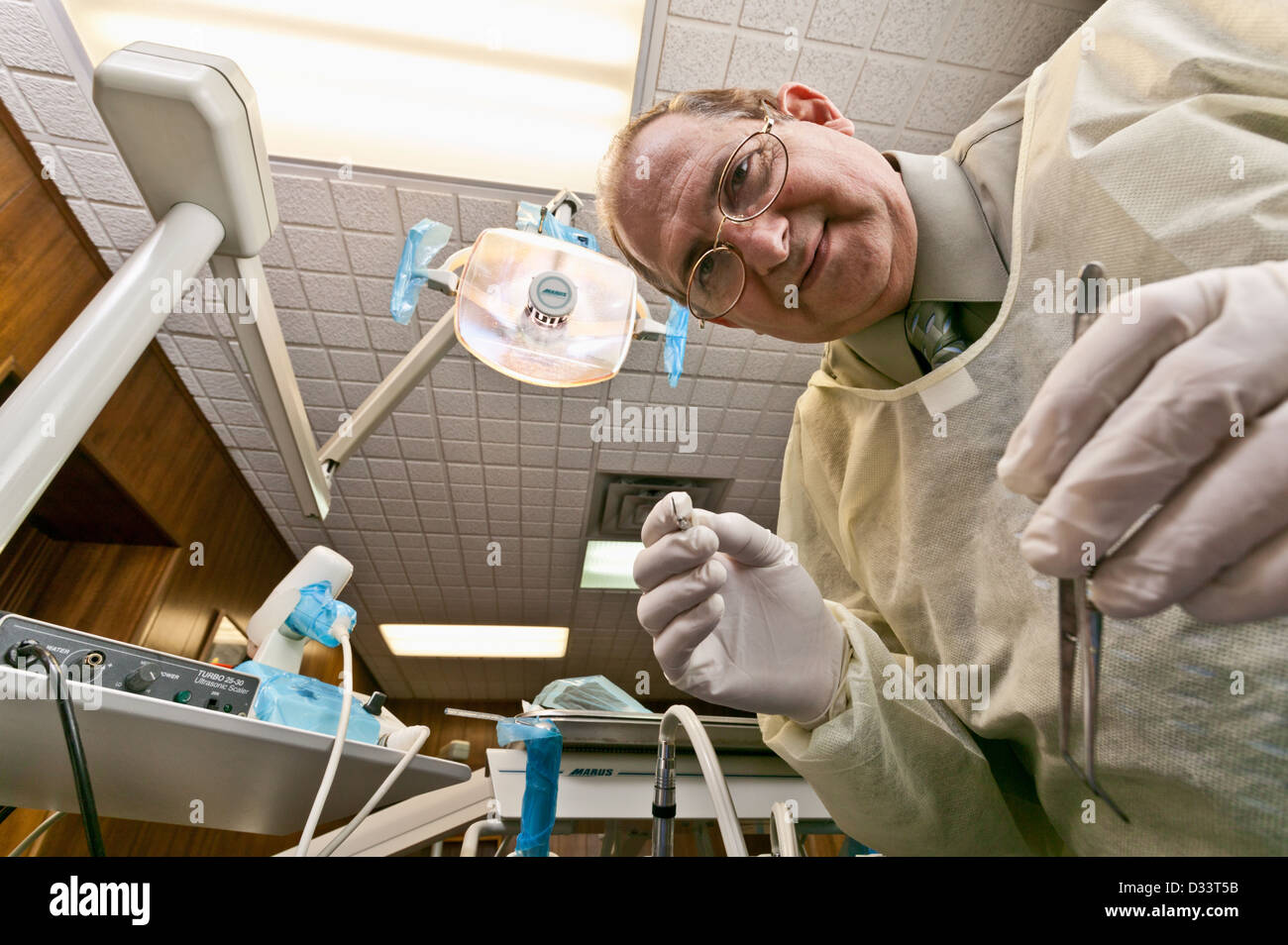 Dentist working on a patient Stock Photo - Alamy