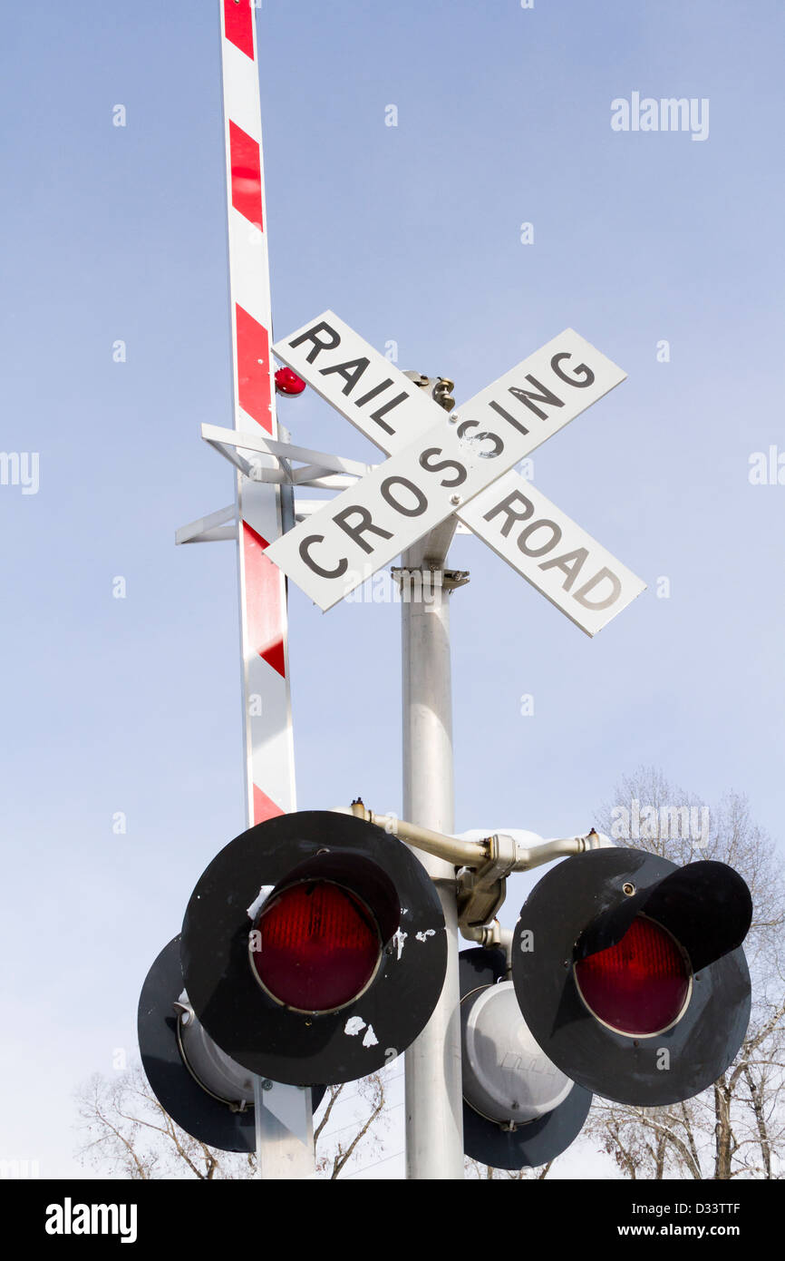 Railroad crossing sign from below with blue sky as a backdrop Stock ...