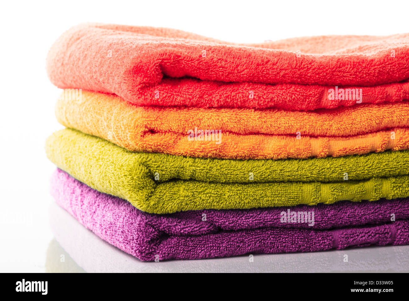 Stack of colorfull towels isolated on white Stock Photo - Alamy