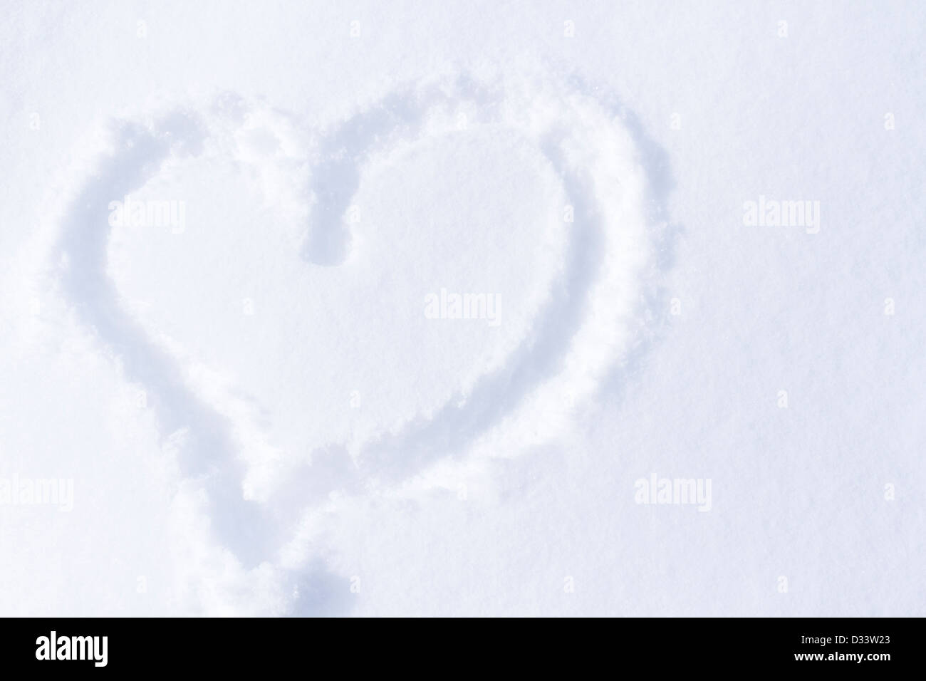 Drawing of a heart on fresh snow Stock Photo - Alamy