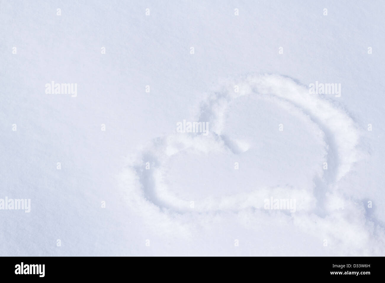 Drawing of a heart on fresh snow Stock Photo - Alamy