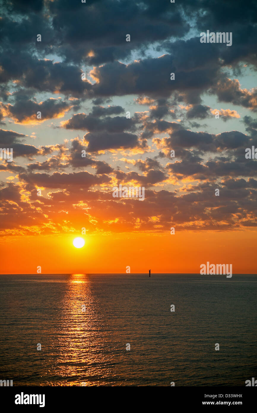 Colored sunrise over the sea Stock Photo - Alamy