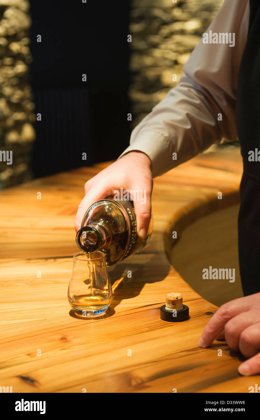 Pouring a dram of Scottish malt whisky Stock Photo - Alamy
