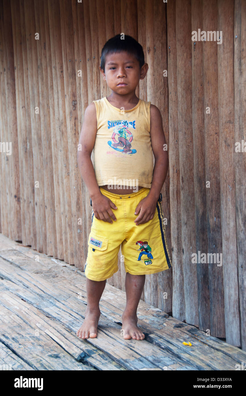 An indio child, Matses Mayorunas people, Buen Peru village, Amazonian ...