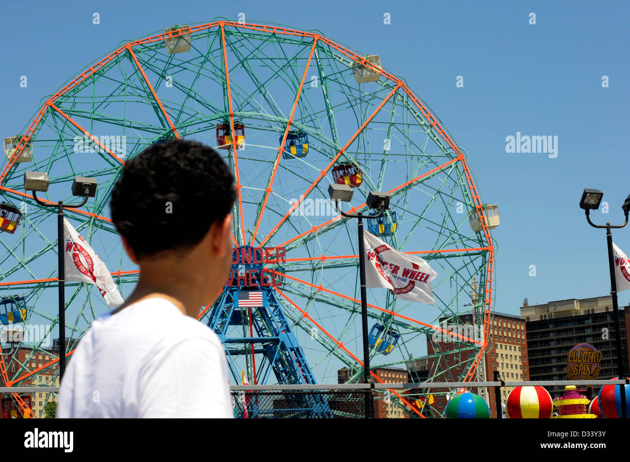 People enjoy the exuberance of the thrill of the fun fair rides at ...