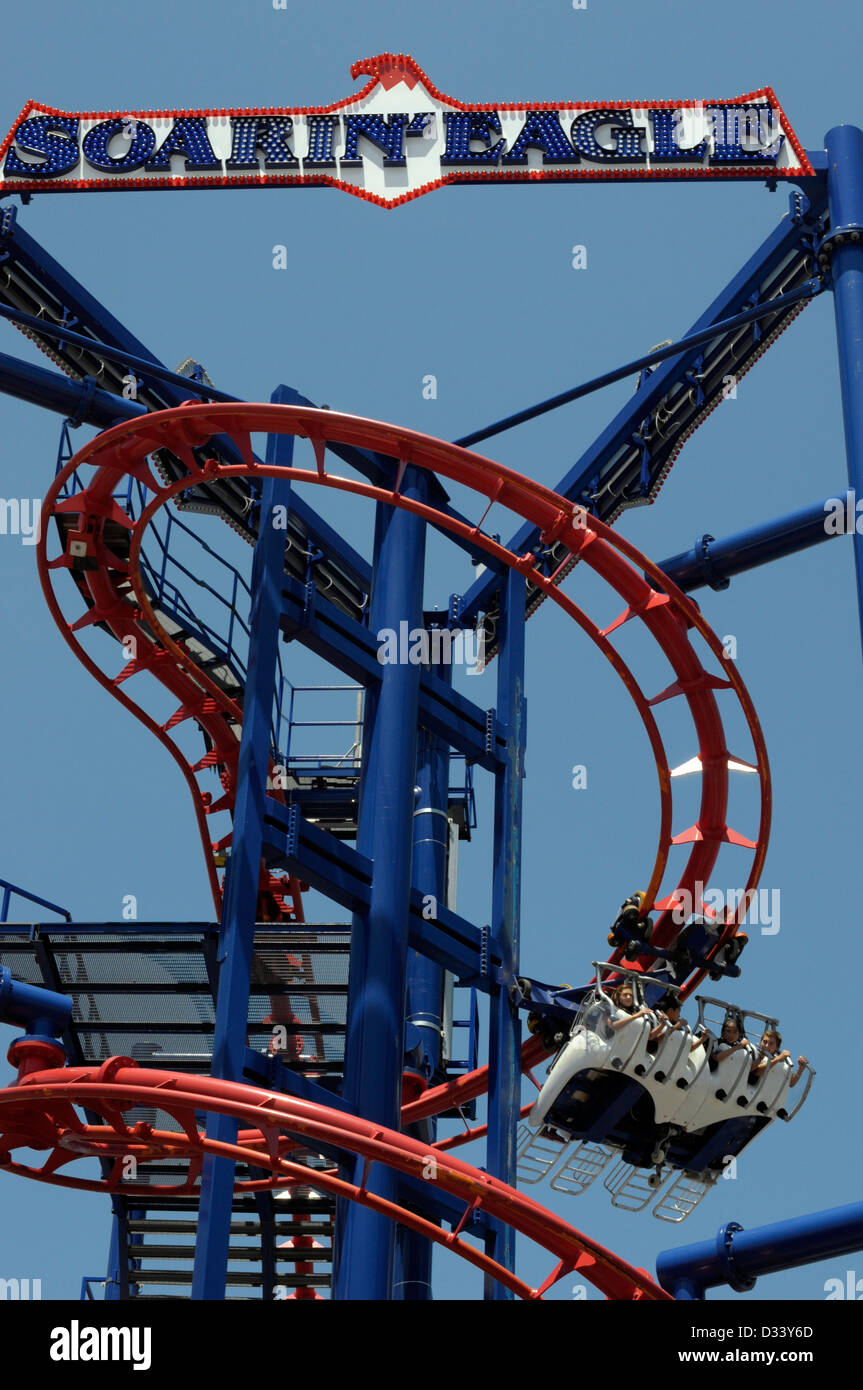 People enjoy the exuberance of the thrill of the fun fair rides at ...