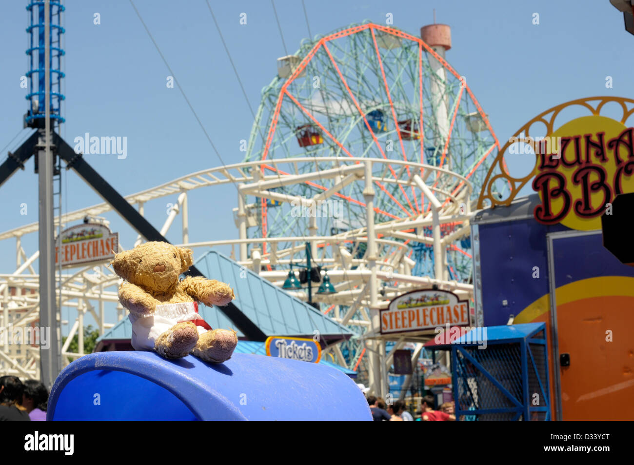 People enjoy the exuberance of the thrill of the fun fair rides at ...